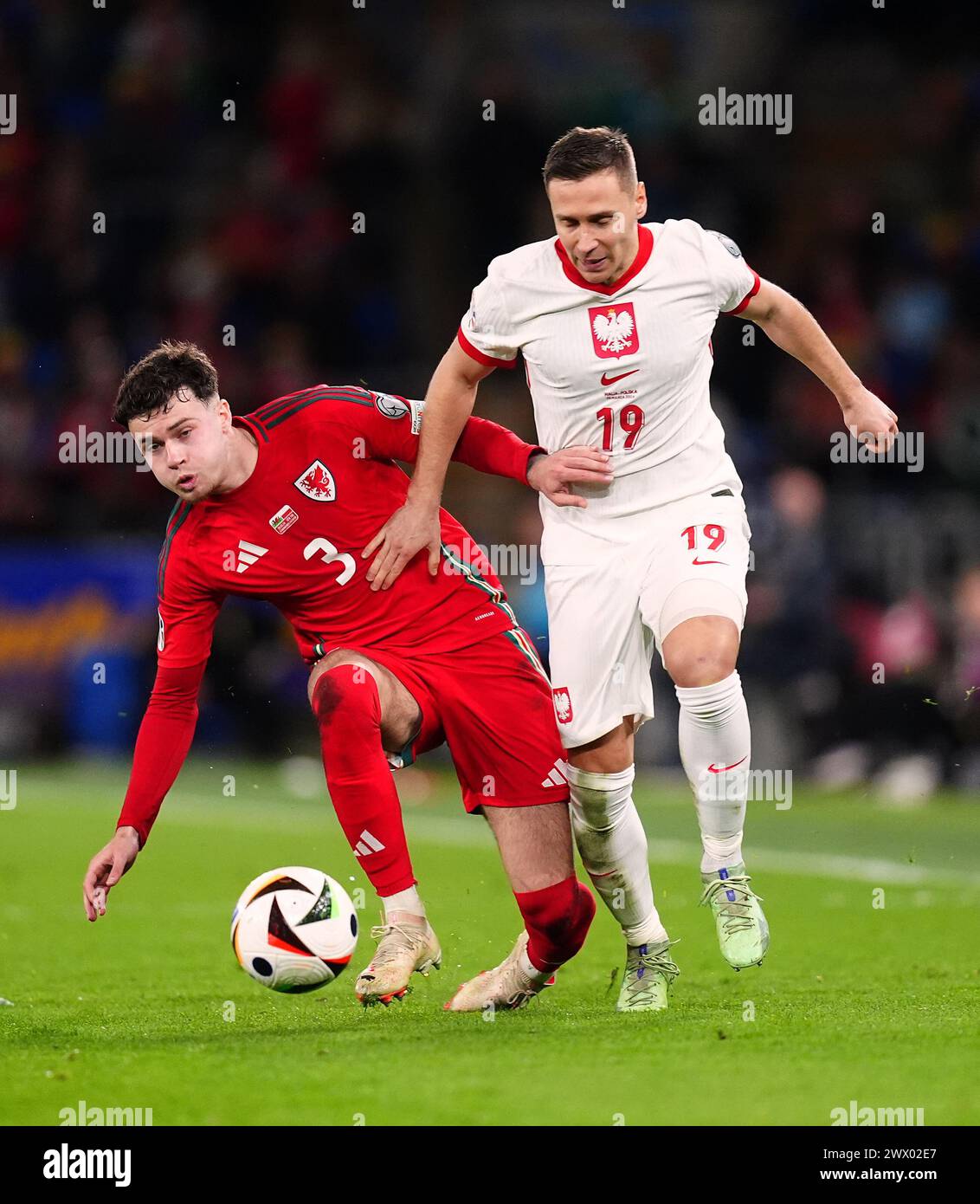Wales' Neco Williams and Poland's Przemyslaw Frankowski (right) during ...