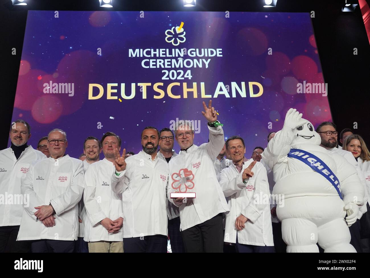 26 March 2024, Hamburg: Three-star chef Edip Sigl (center l) from the ...