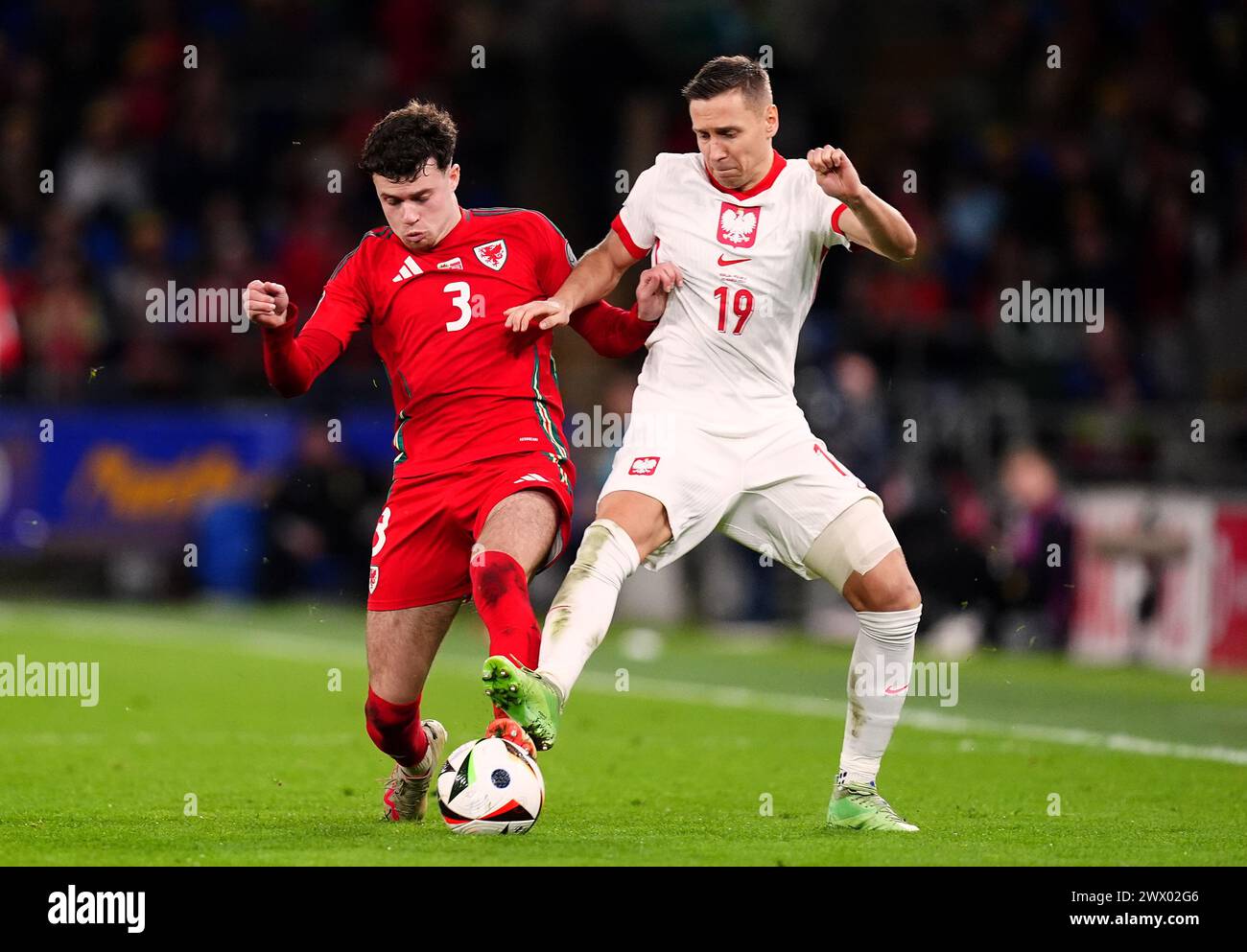 Wales' Neco Williams and Poland's Przemyslaw Frankowski (right) during ...