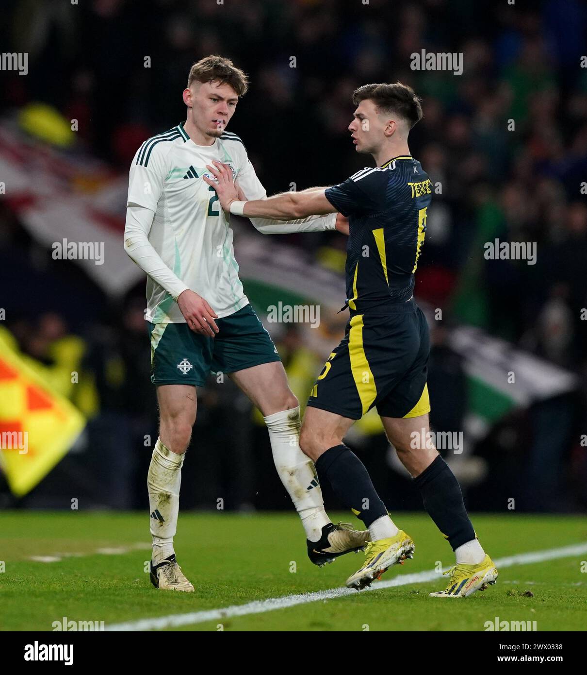 Scotland's Kieran Tierney pushes Northern Ireland's Conor Bradley (left ...