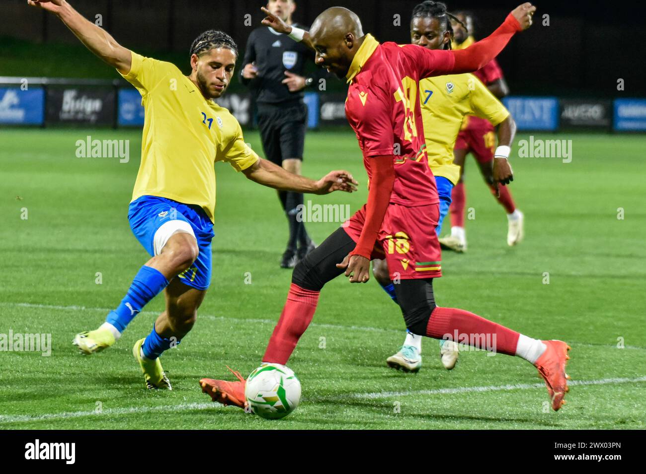 CHAMBLY, FRANCE - MARCH 25; Jeremy Oyono of Gabon and Mons Bassoumina ...