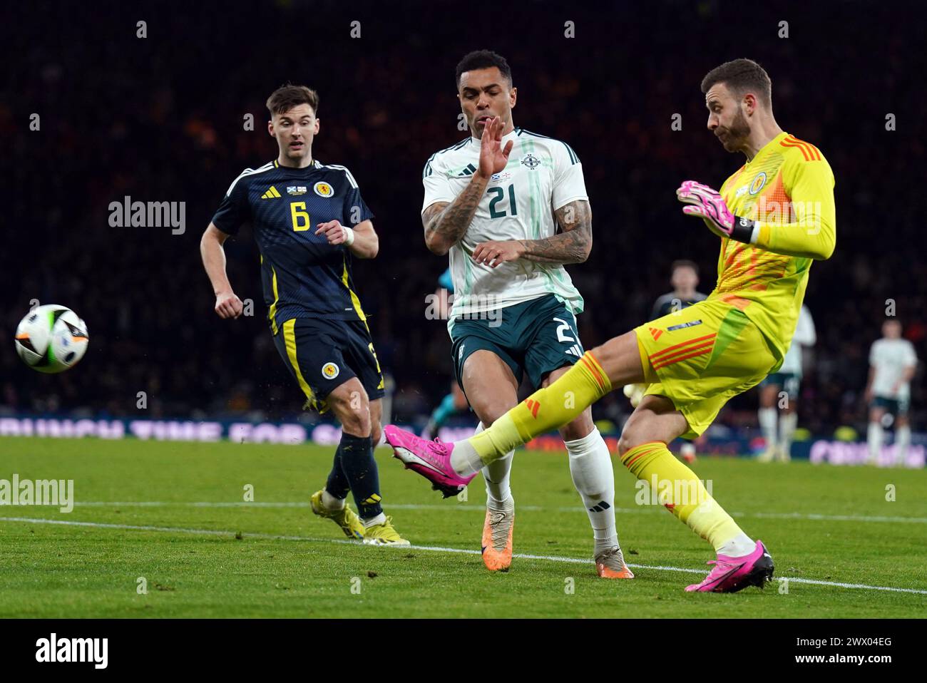 Scotland goalkeeper Angus Gunn clears under pressure from Northern ...