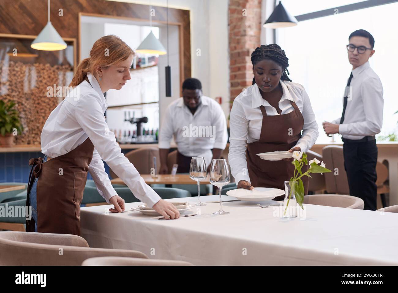 Asian woman waiting tables hi-res stock photography and images - Alamy