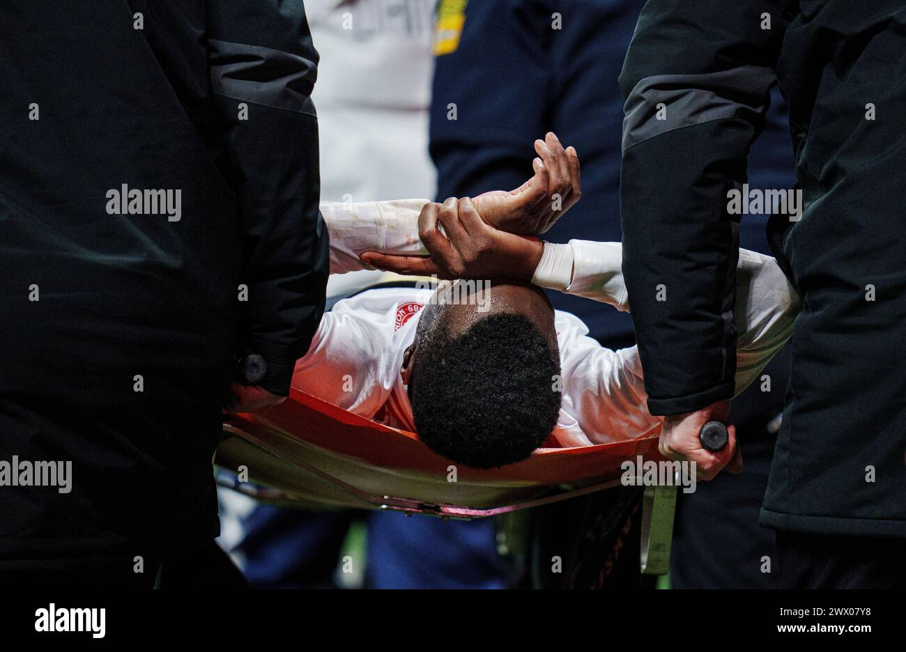 Denmark's Mohamed Daramy is injured with his knee during the friendly ...
