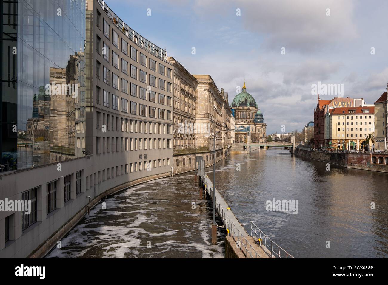 The river flows along the ancient houses of the European city of Berlin ...