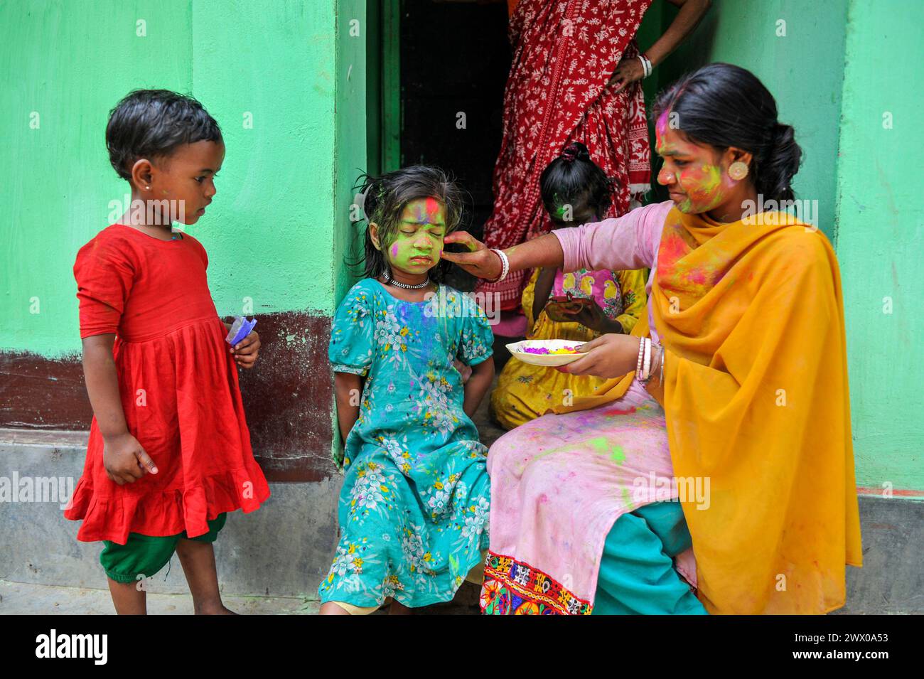 Non Exclusive: March 26, 2024, Sylhet, Bangladesh: A woman paints the ...