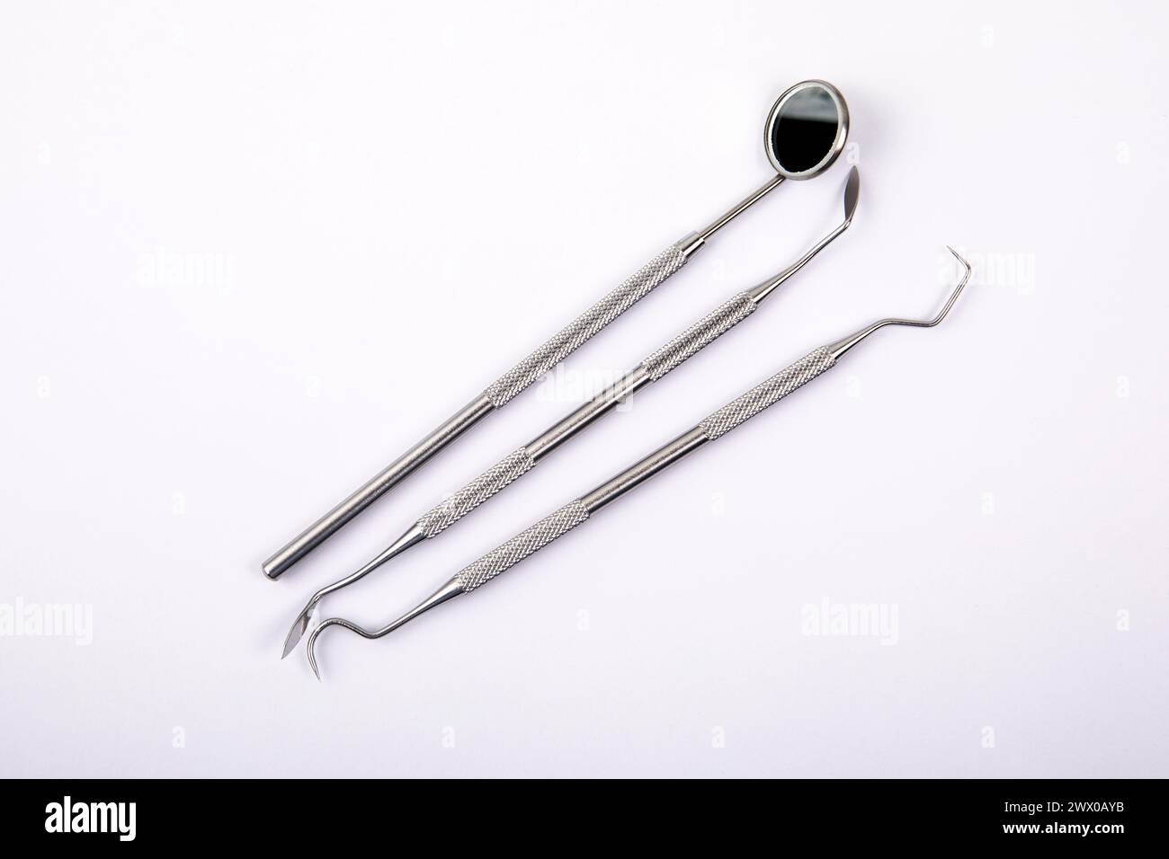 Set of dental instruments on a white background. Health and hygiene ...