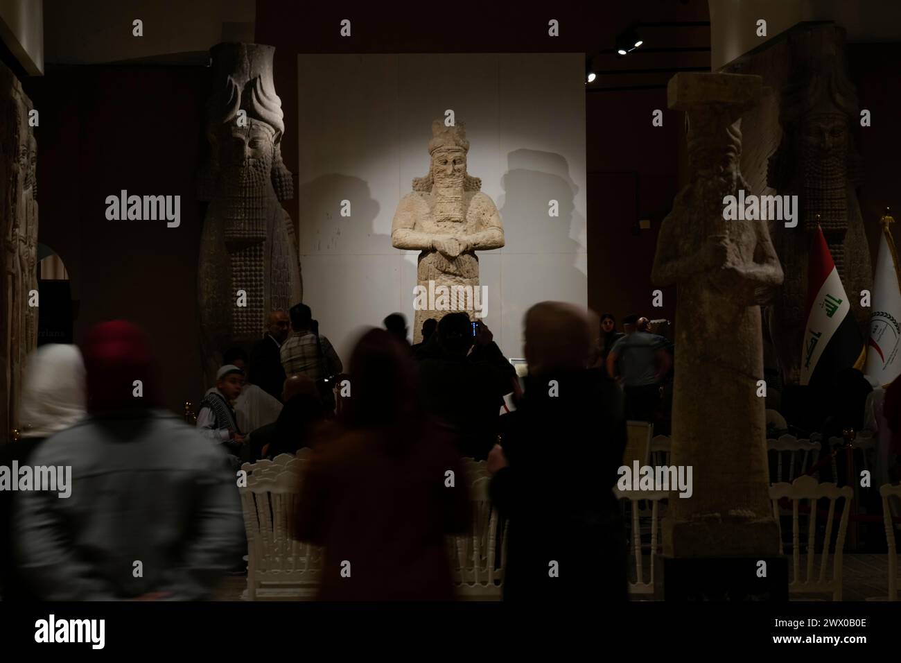 People visit the Assyrian Hall at the Iraq National Museum, in Baghdad ...