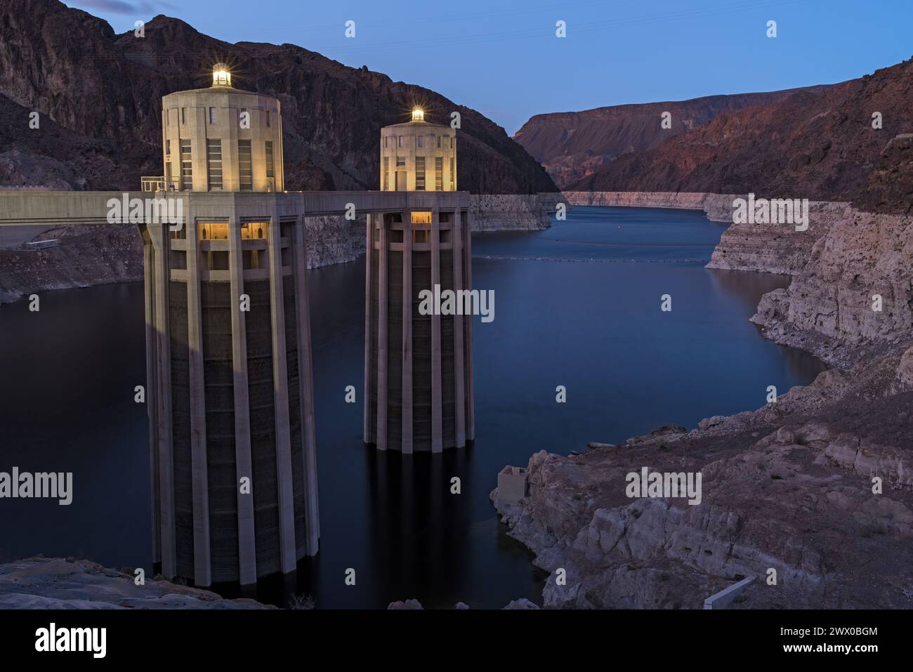 Hoover Dam intake towers and Lake Meade reservoir shown at dusk. Recent ...
