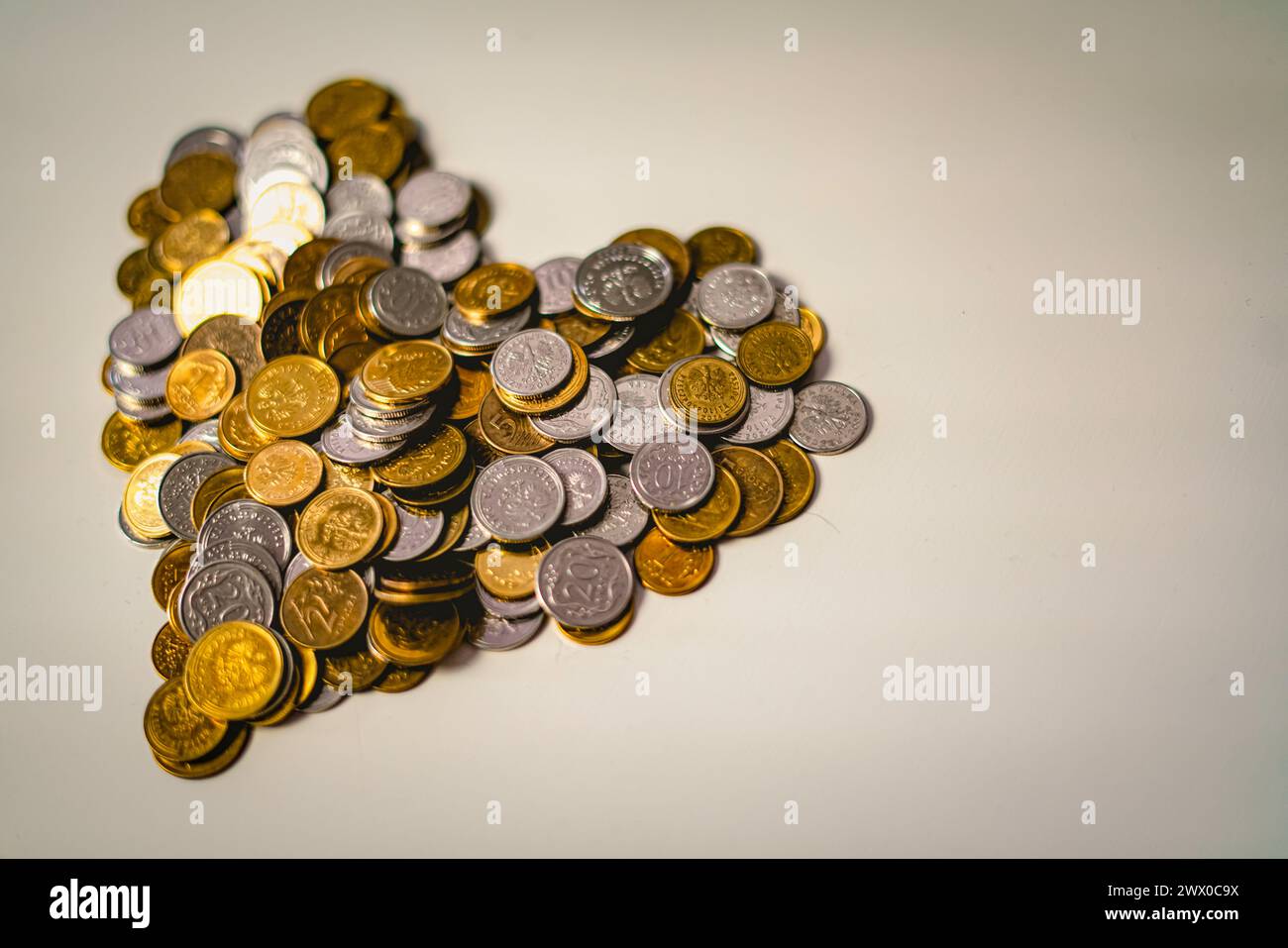 Heart shaped polish coins Stock Photo - Alamy
