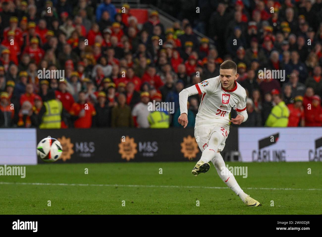 Sebastian Szymański of Poland scores his penalty during the UEFA Euro ...