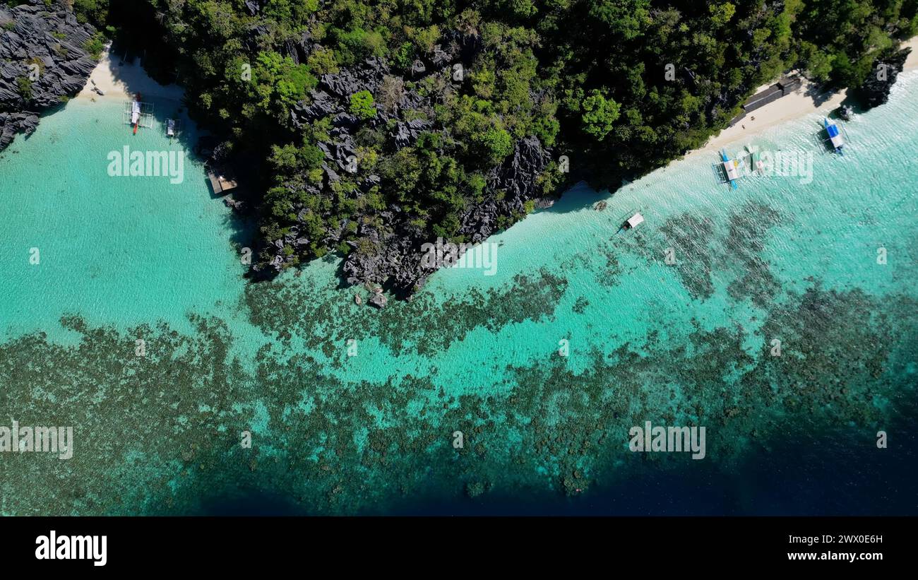 Tropical island with beach rocks coral reef Stock Photo - Alamy