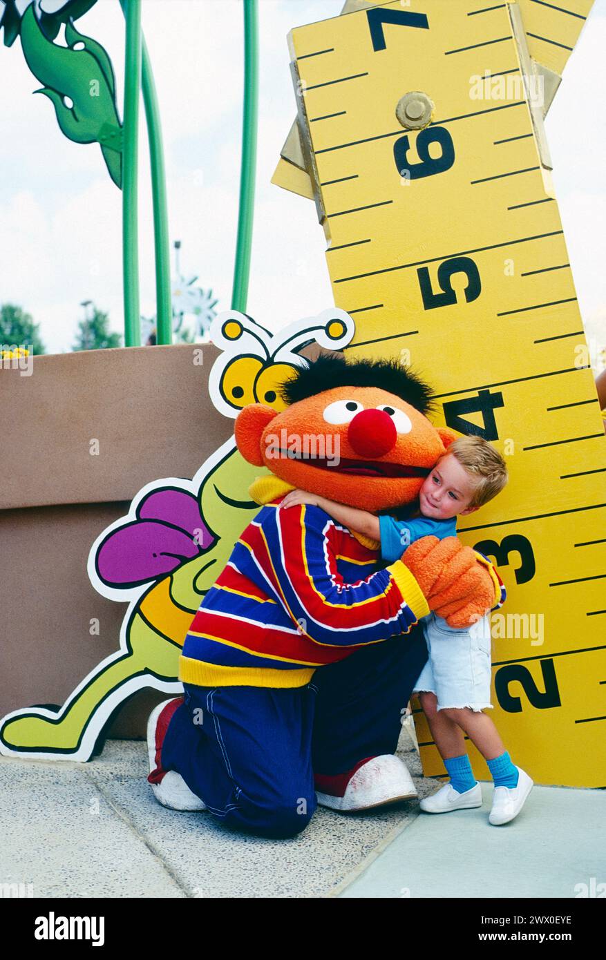 Little boy hugs character "Ernie"; Sesame Place; Langhorne ...