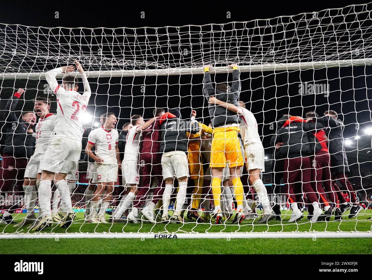 Poland goalkeeper Wojciech Szczesny celebrates saving the penalty of ...