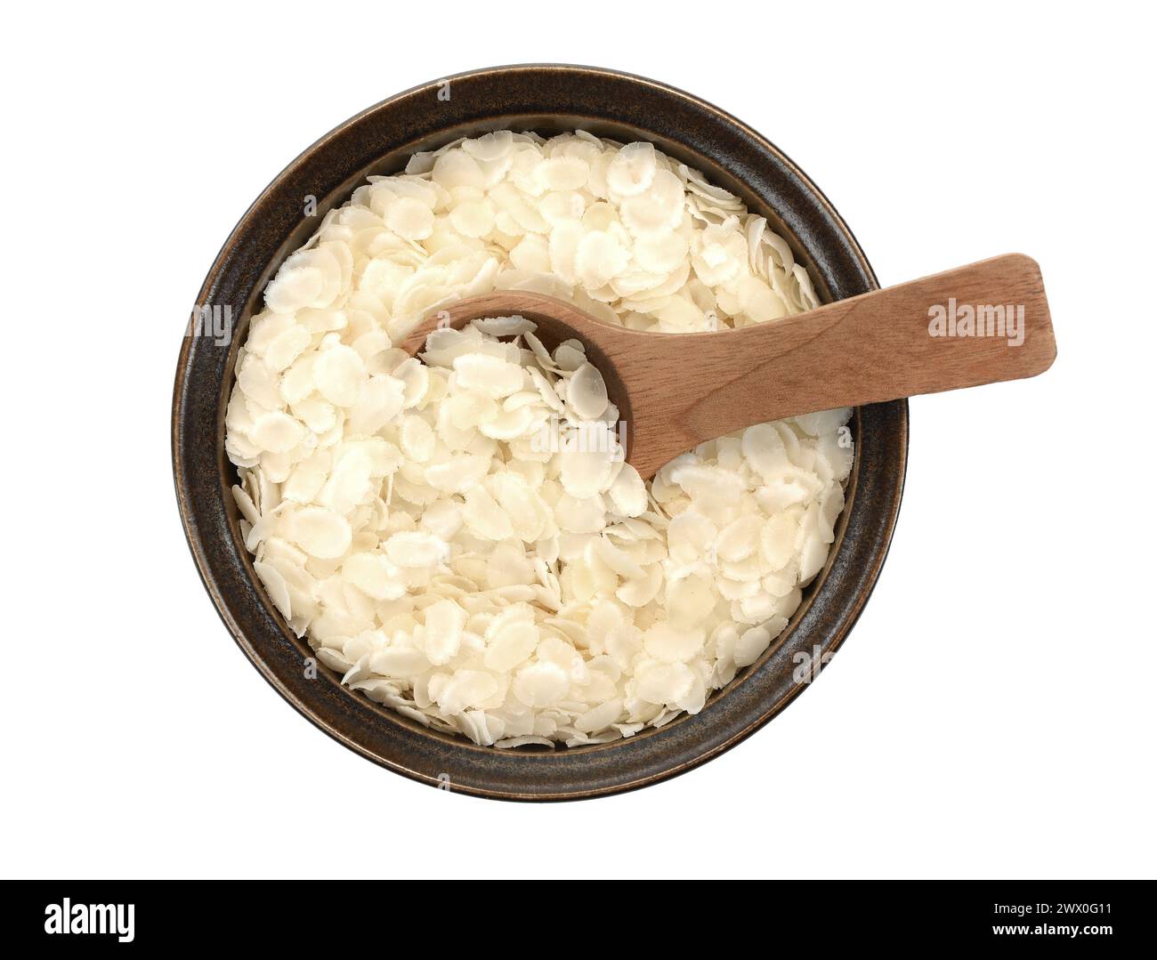flattened rice flakes in a ceramic bowl isolated on white Stock Photo ...
