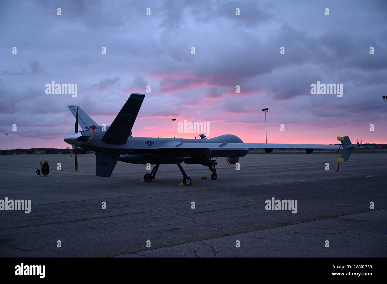 A remotely piloted MQ-9 Reaper from the 163rd Attack Wing sits in front ...