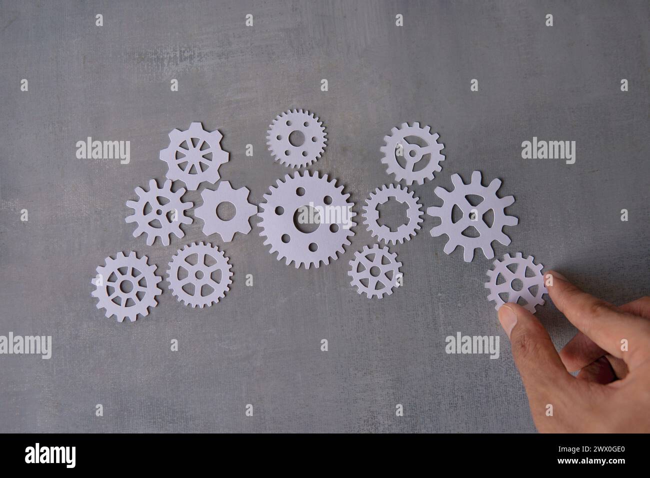 Top view image of hand arrange cogwheel. Solution, process, flow and ...