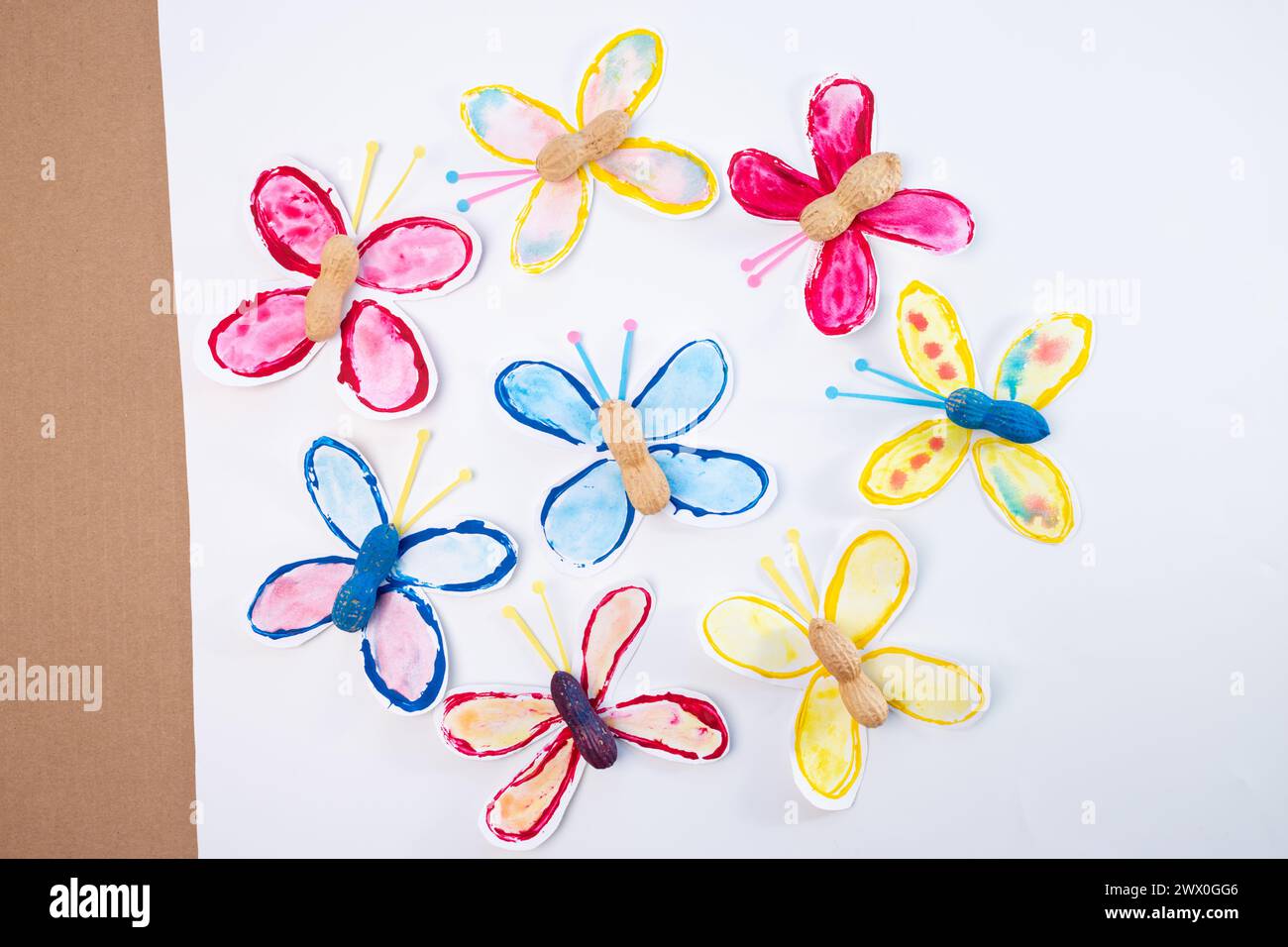 making paper craft butterflies, stamp, paint tubes, recycling concept ...