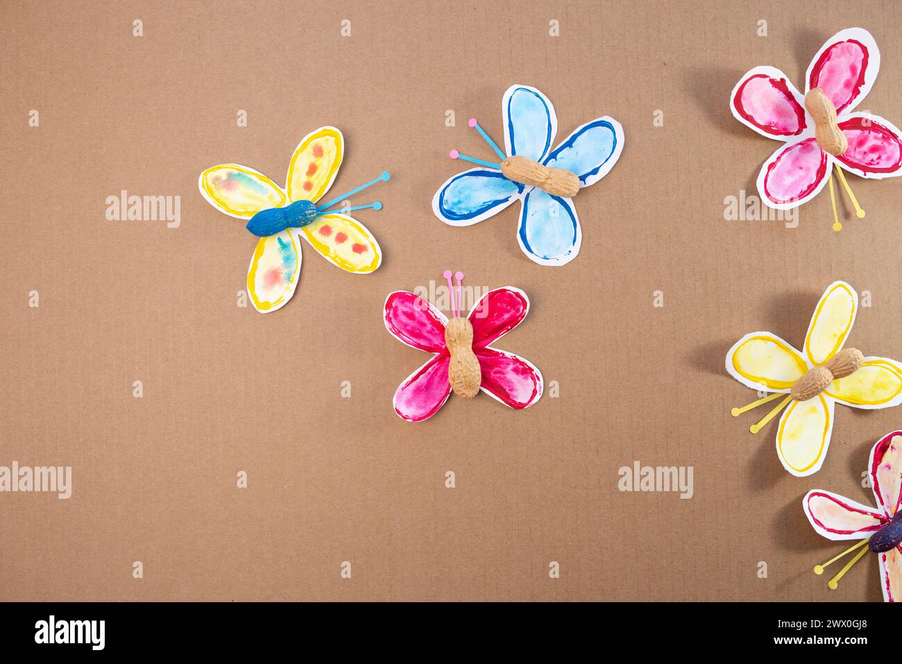 making paper craft butterflies, stamp, paint tubes, recycling concept ...