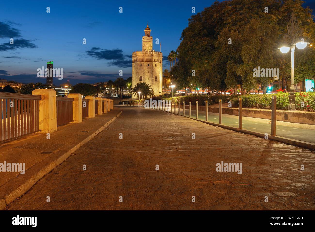 The famous Golden Tower in Seville at sunset Stock Photo - Alamy