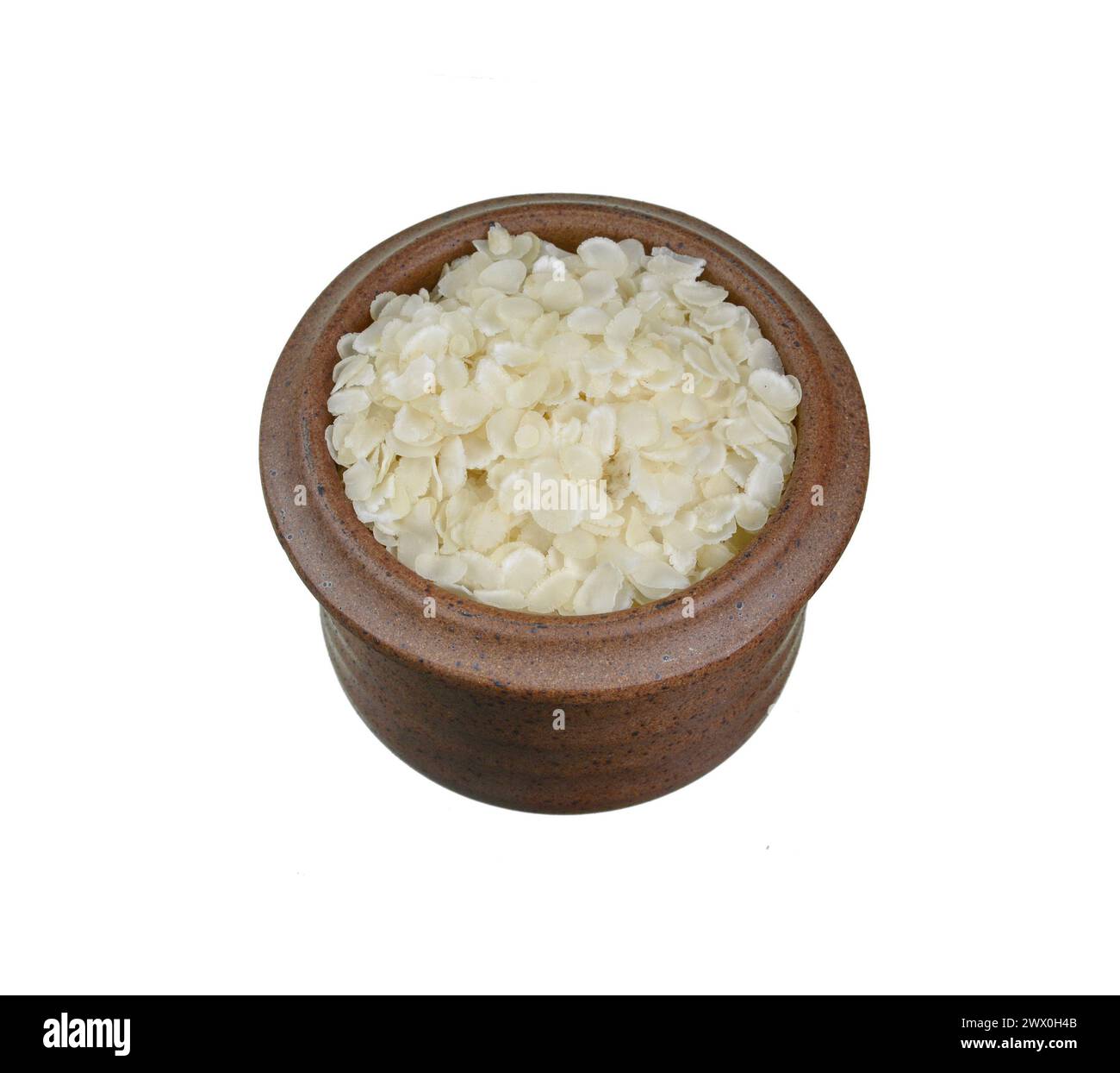 flattened rice flakes isolated on white Stock Photo - Alamy