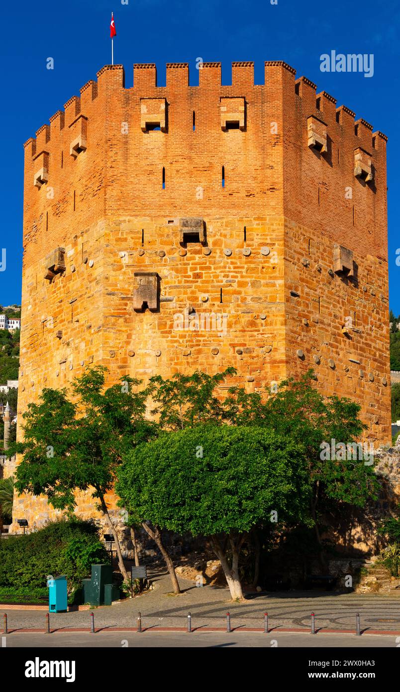 Red Tower and the fortification wall of a medieval castle in Turkish ...
