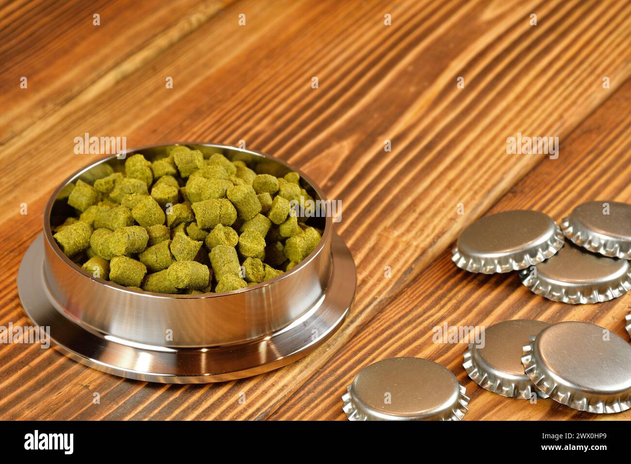 Hop pellets for beer brewing. Home brewing ingredient and beer bottle ...