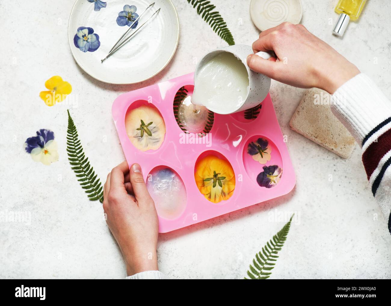 Step. 3 Pouring liquid homemade soap mass into silicone mold. The ...