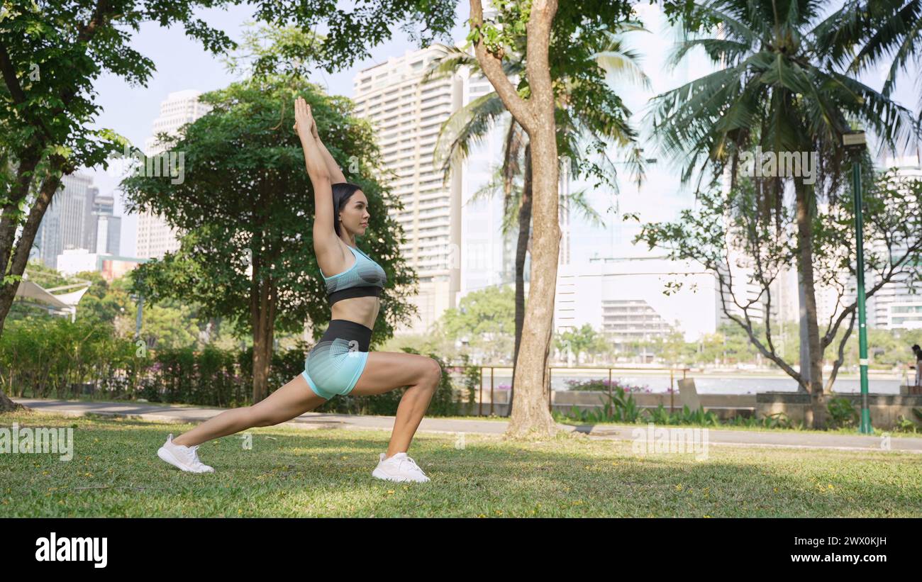 Healthy Woman Exercising in Green City Park Stock Photo - Alamy