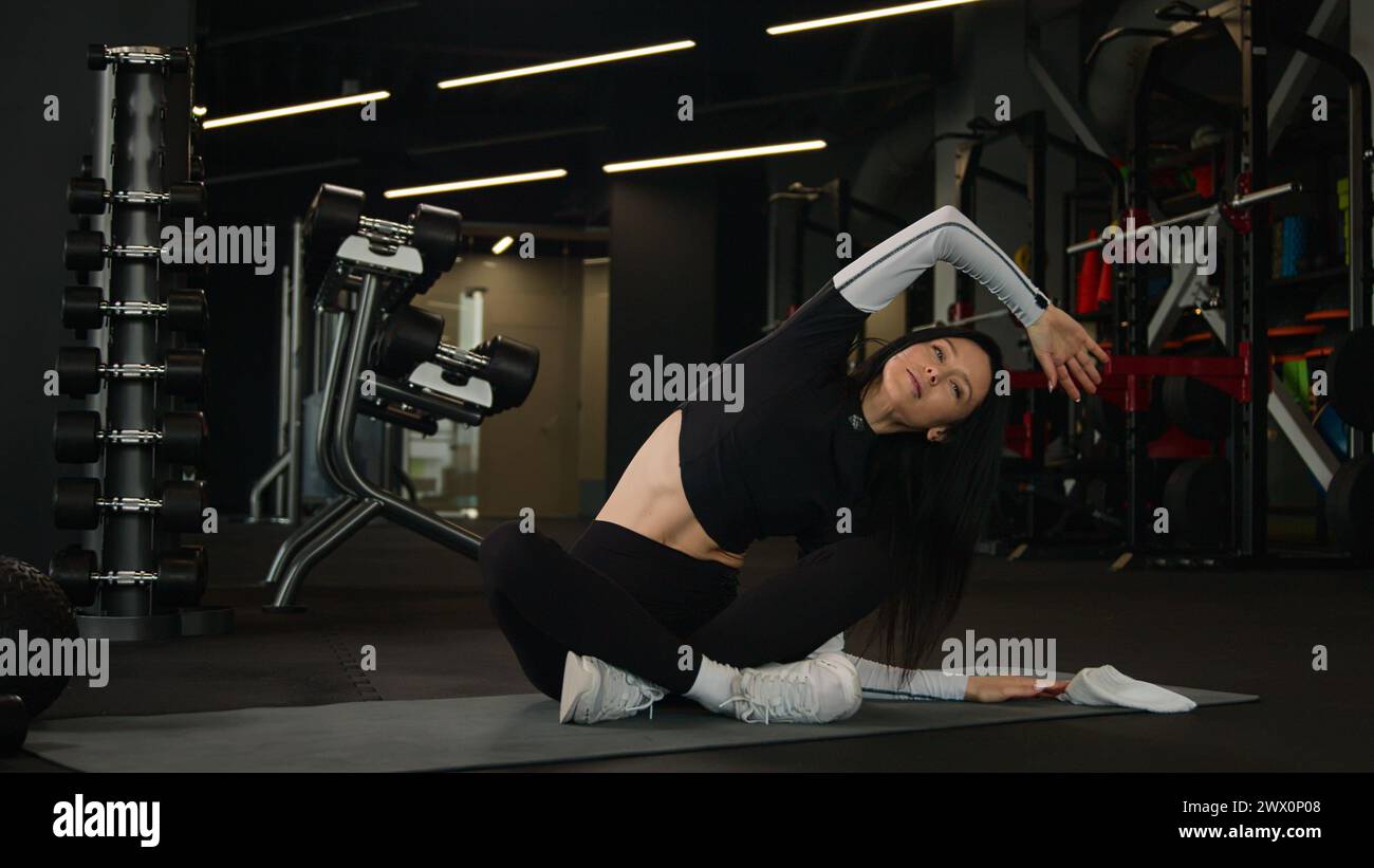 Fit slim Caucasian sportswoman athletic healthy active woman stretch ...