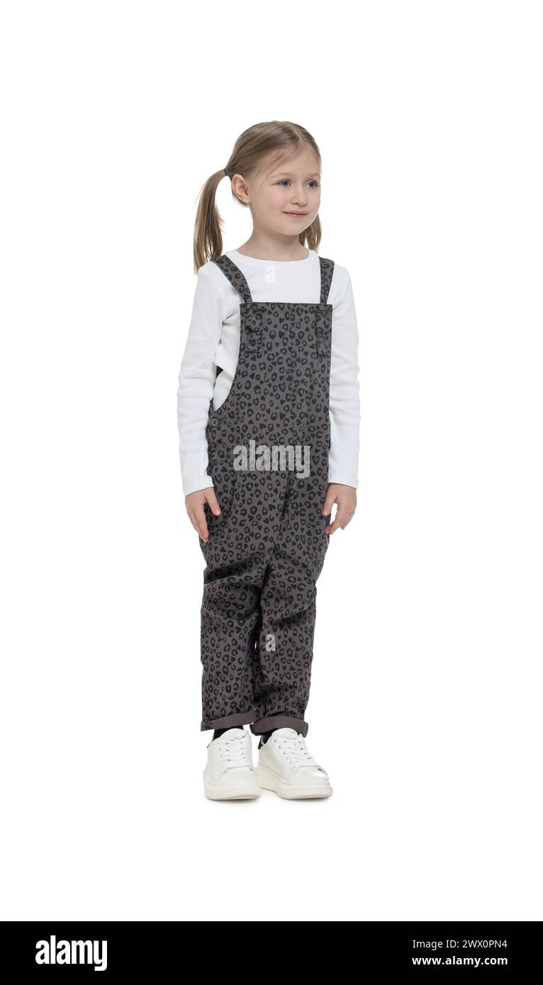 Cute girl in stylish overall on white background Stock Photo - Alamy