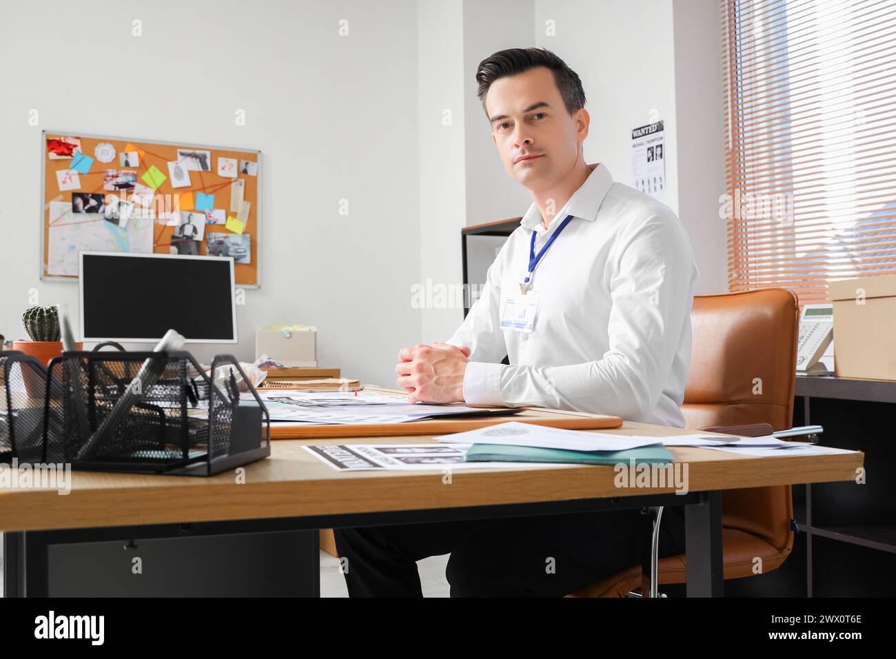 Portrait of FBI agent sitting in office Stock Photo - Alamy