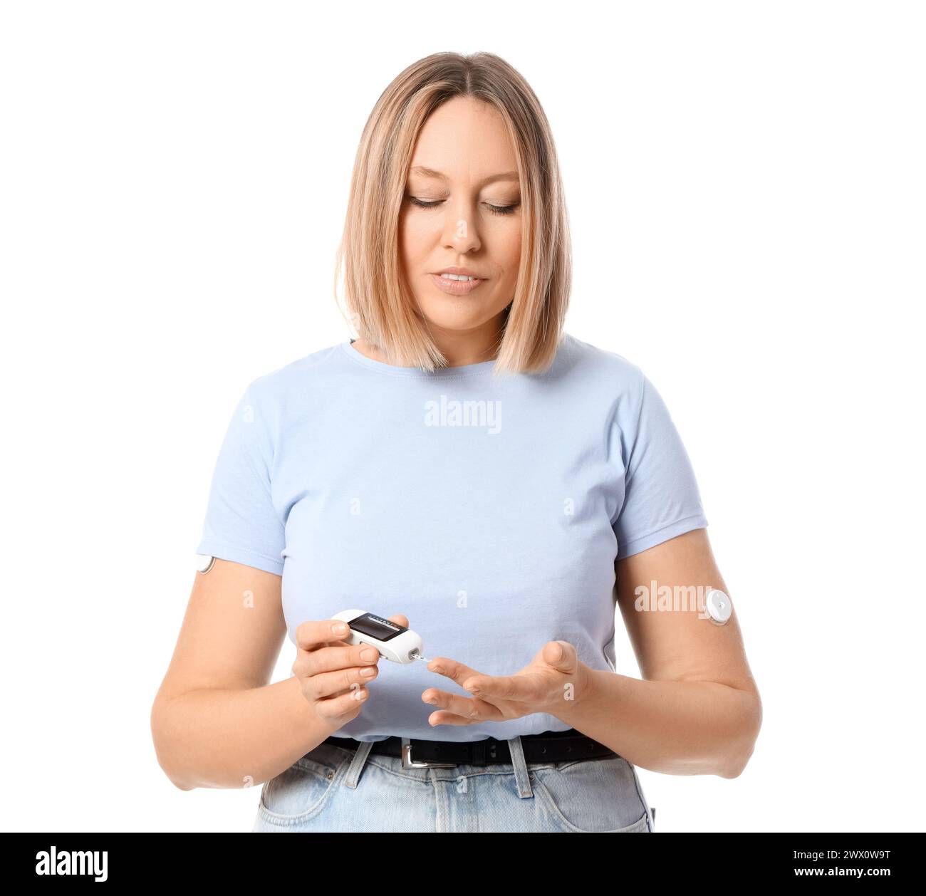 Diabetic woman using glucometer on white background Stock Photo - Alamy