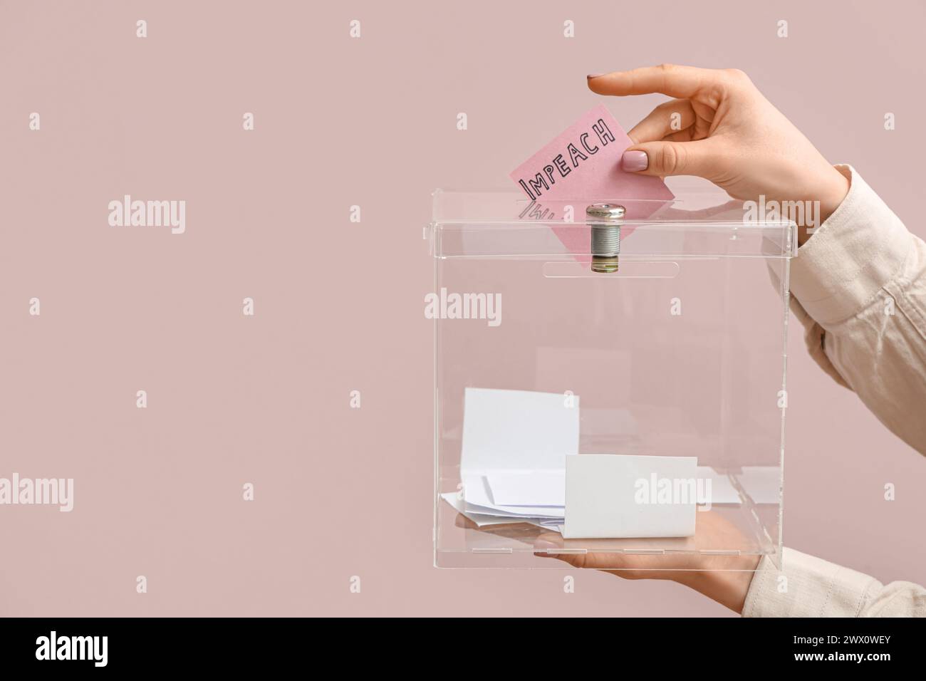 Woman putting ballot paper with word IMPEACH in voting box on pink ...