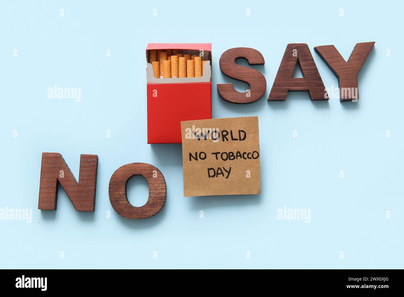 Text SAY NO, pack of cigarettes and card with phrase WORLD NO TOBACCO ...