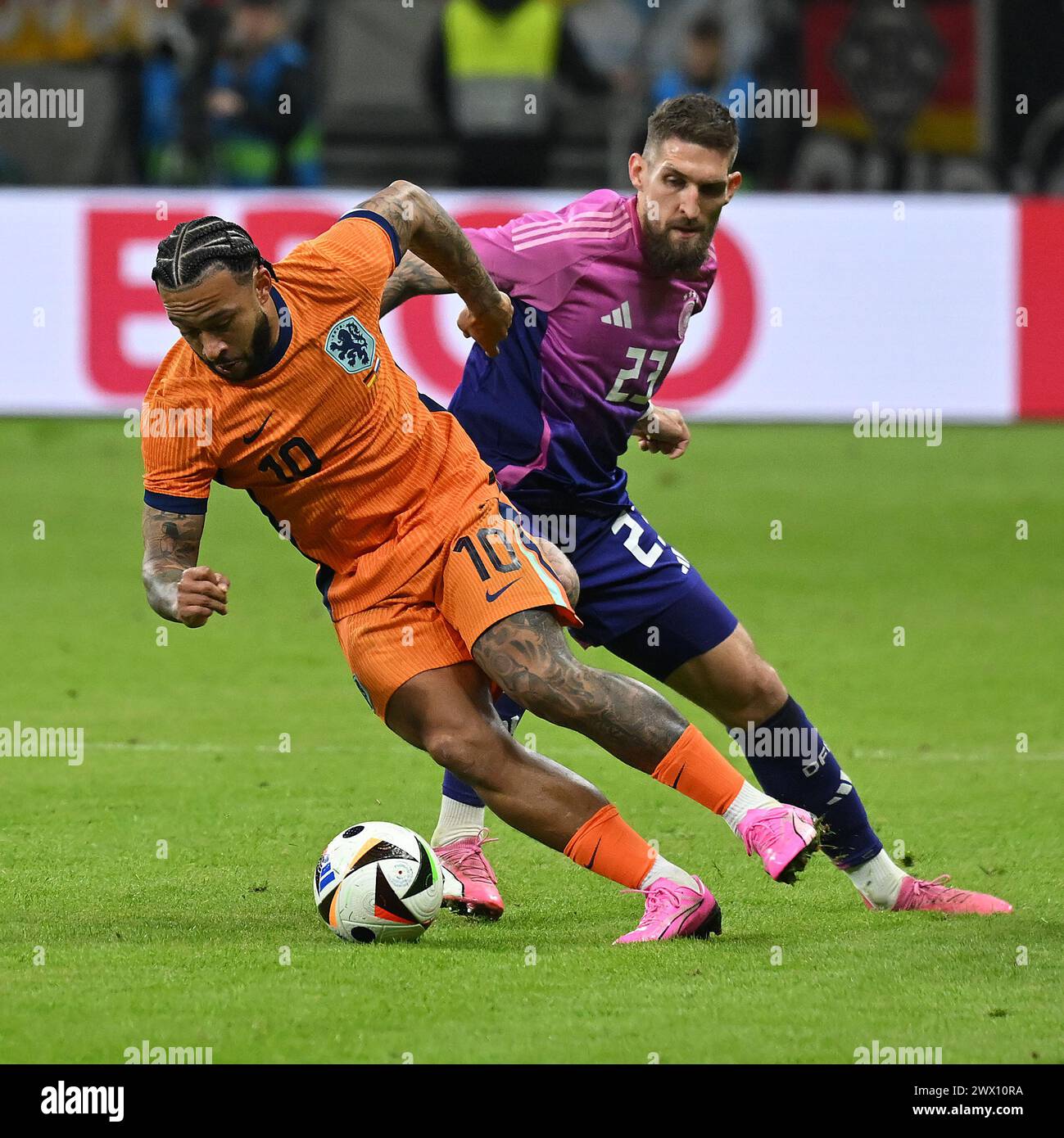 Frankfurt, Germany. 26th Mar, 2024. Robert Andrich (R) of Germany vies ...