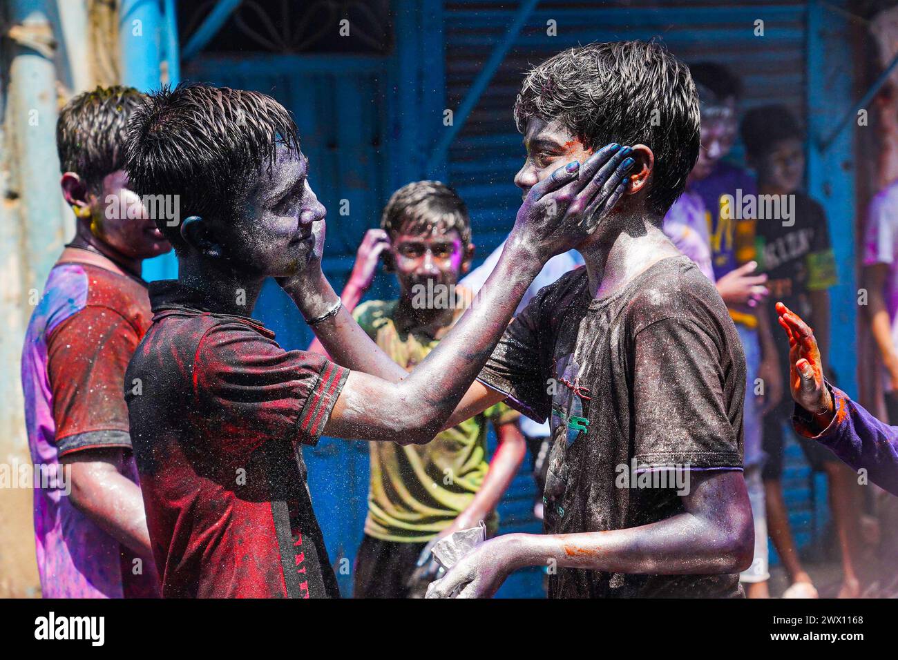 March 26, 2024, Dhaka, Bangladesh: Two young people paint each other's ...