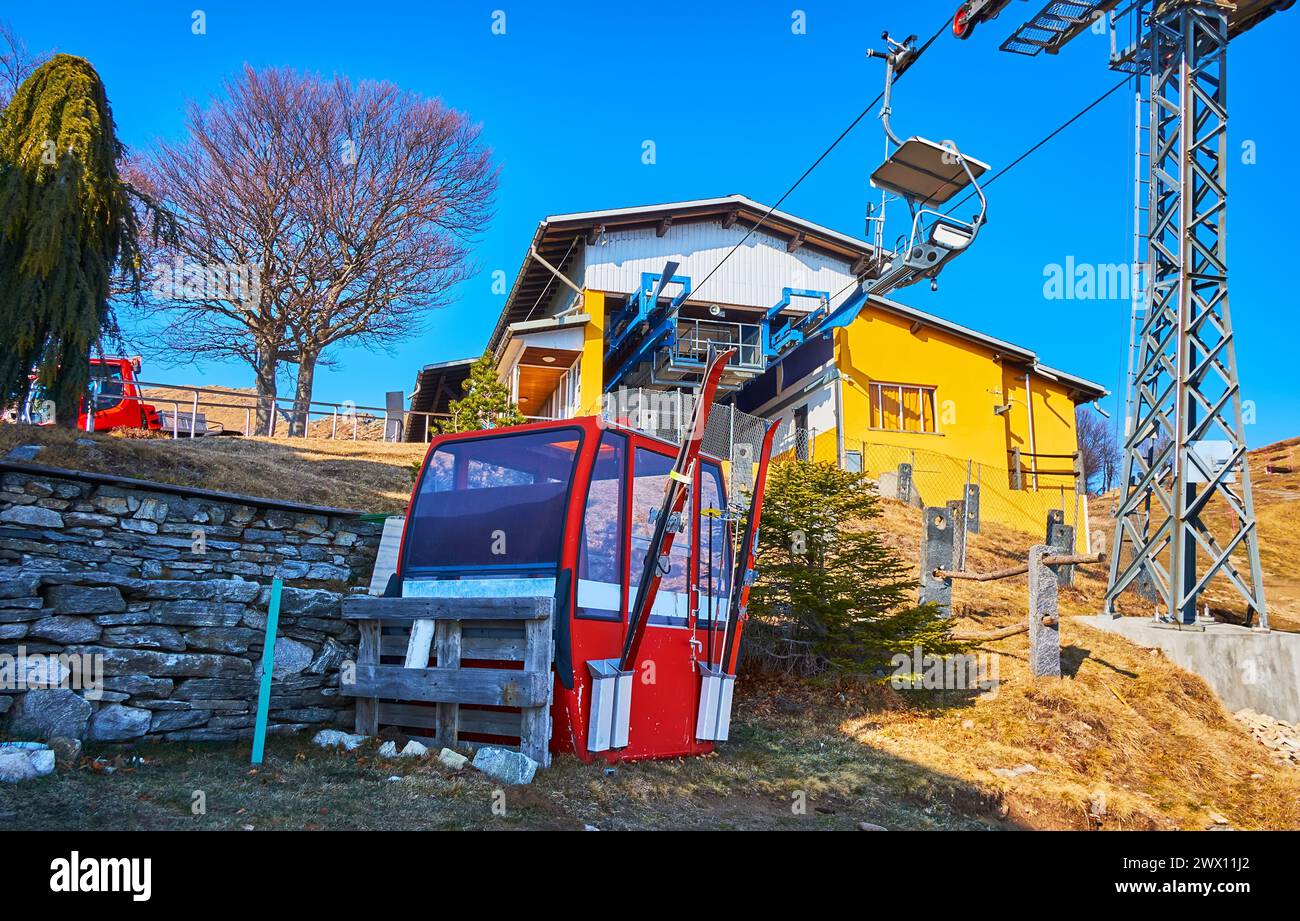 The vintage red air gondola cabin in front of the upper station of ...