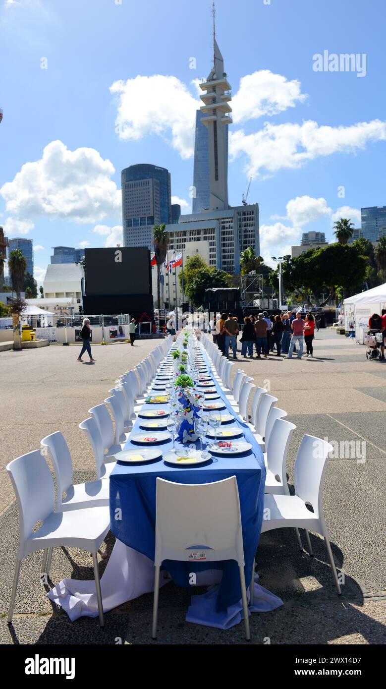 An installation of a Sabbath dinner table with chairs for the hostages ...