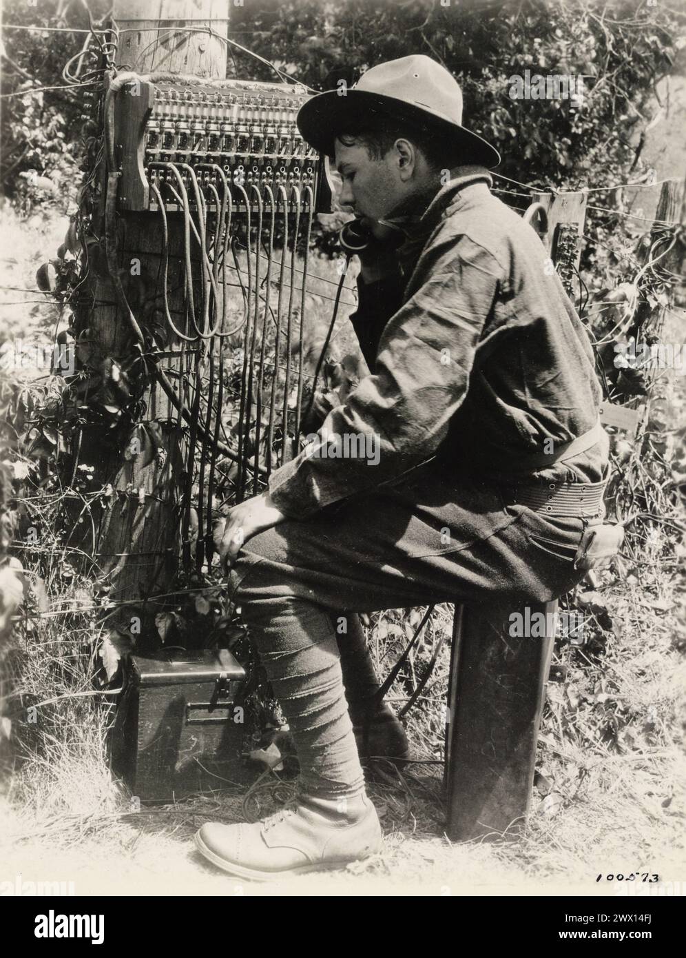 A soldier using a field telephone switchboard in operation during ...
