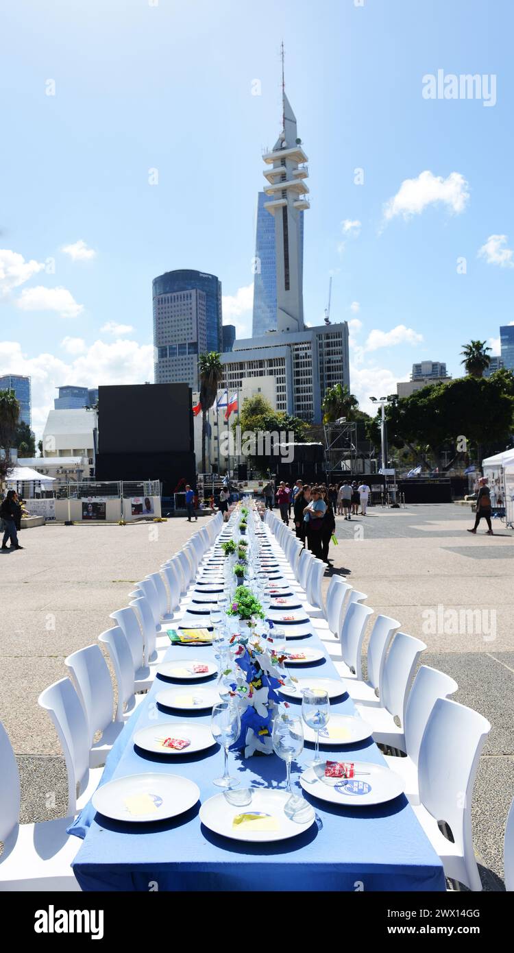 An installation of a Sabbath dinner table with chairs for the hostages ...