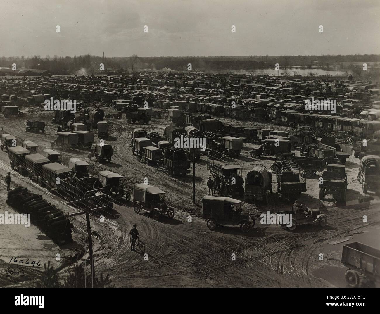 Original caption: Panorama of a convoy of Ford trucks at a truck park ...