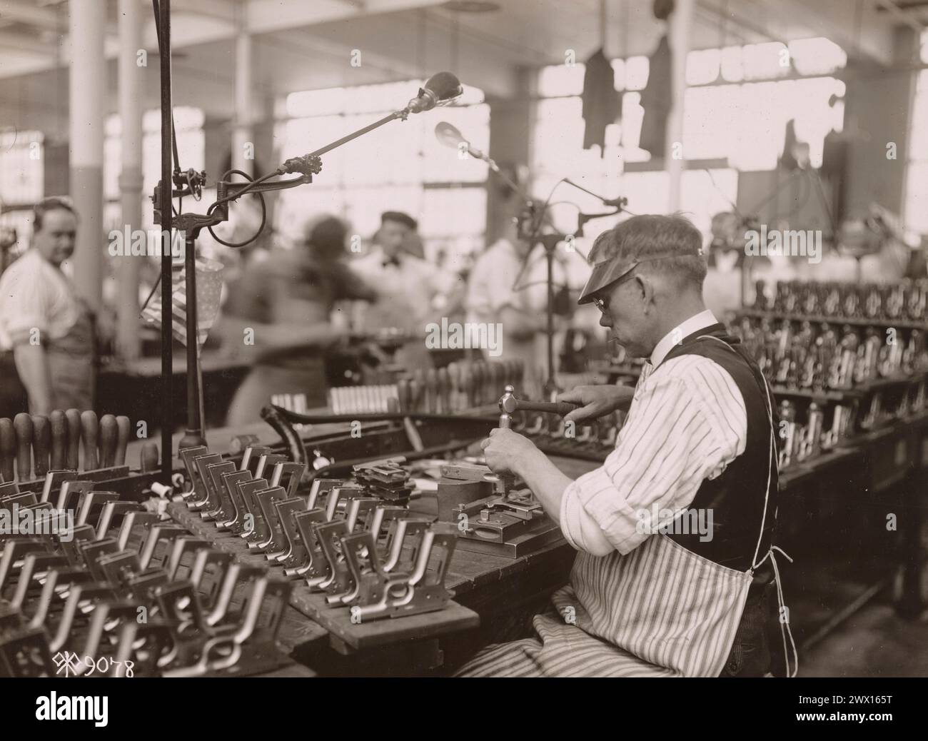 Manufacturing Colt .45 pistols at the Colt Firearms Plant in Hartford ...