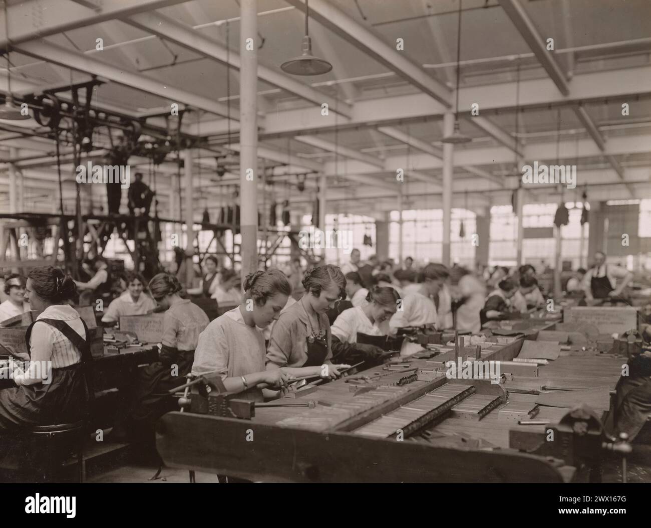 Manufacturing Colt .45 pistols at the Colt Firearms Plant in Hartford ...