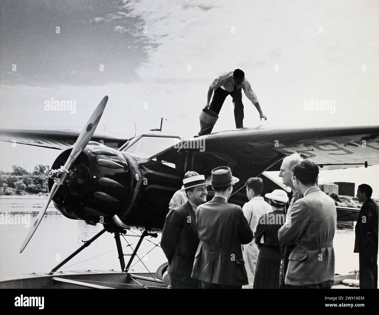 This photograph depicts a sea plane's first refueling stop at a landing ...