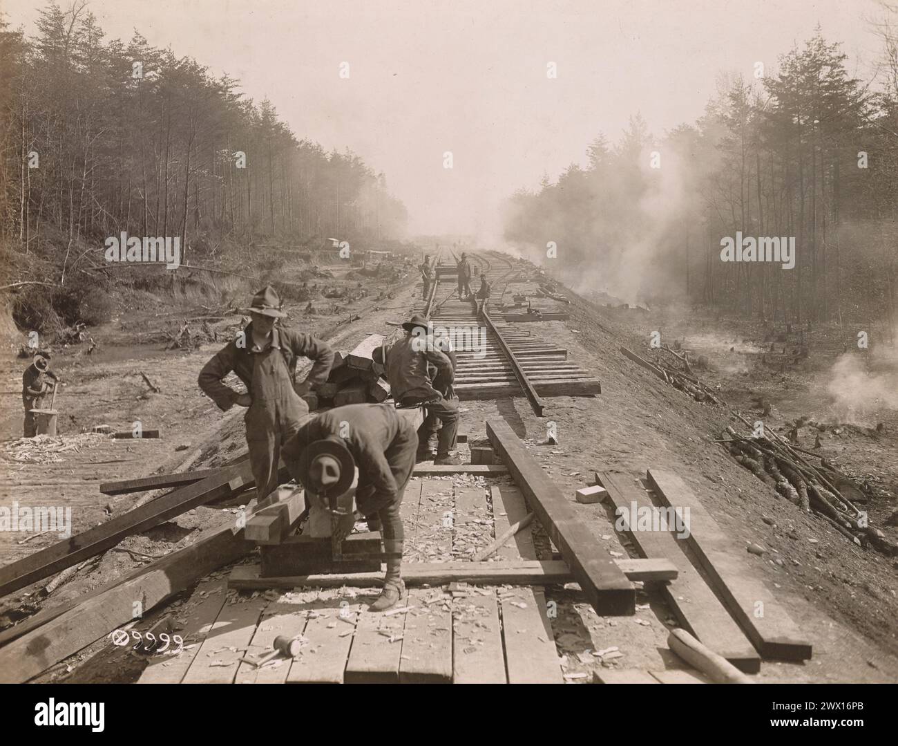 Workers building a railroad, Camp Humphreys, Virginia. Laying rail ...