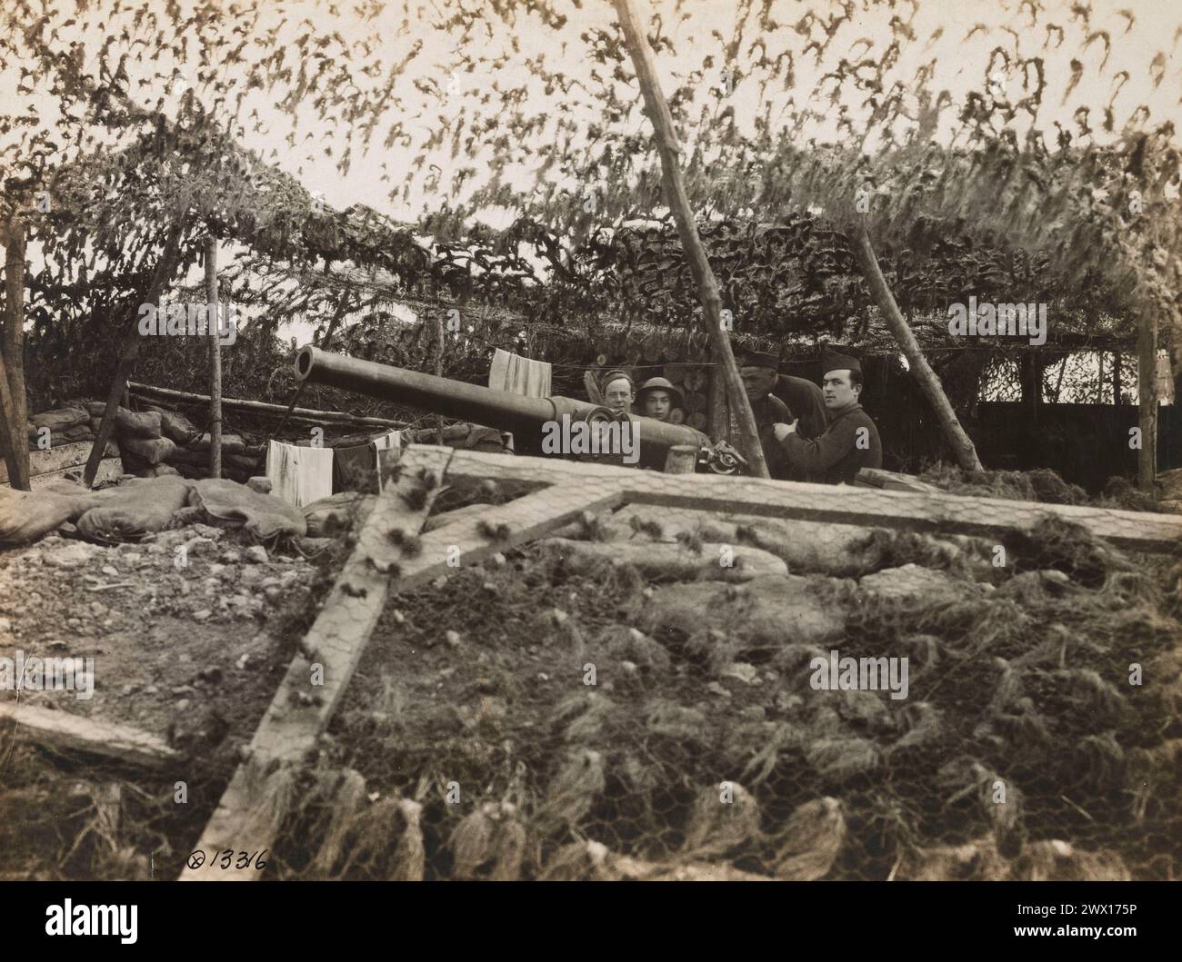 Soldiers at a camouflaged gun position at Dead Man's Curve near ...