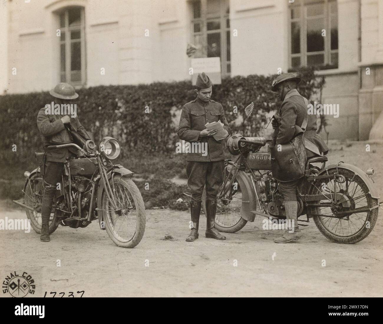 A sergeant deliving official mail to dispatch riders on motorcycles to ...