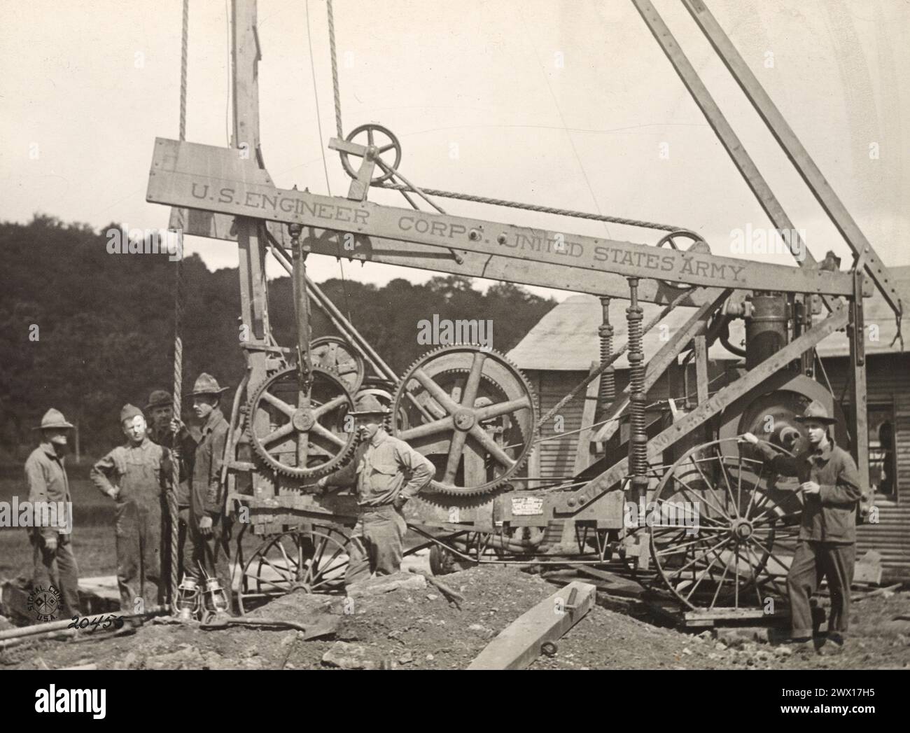 Men of the U.S. Engineers Corps digging a well in France to supply ...