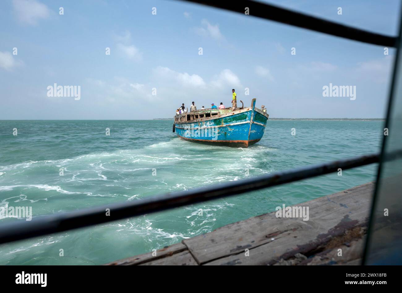 A transport boat (ferry) moves passengers across the Palk Strait from ...
